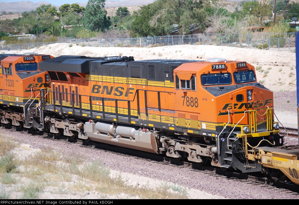 BNSF 7888 and BNSF 7330 start to pull eastbound as they pass me as the rear DPU's.